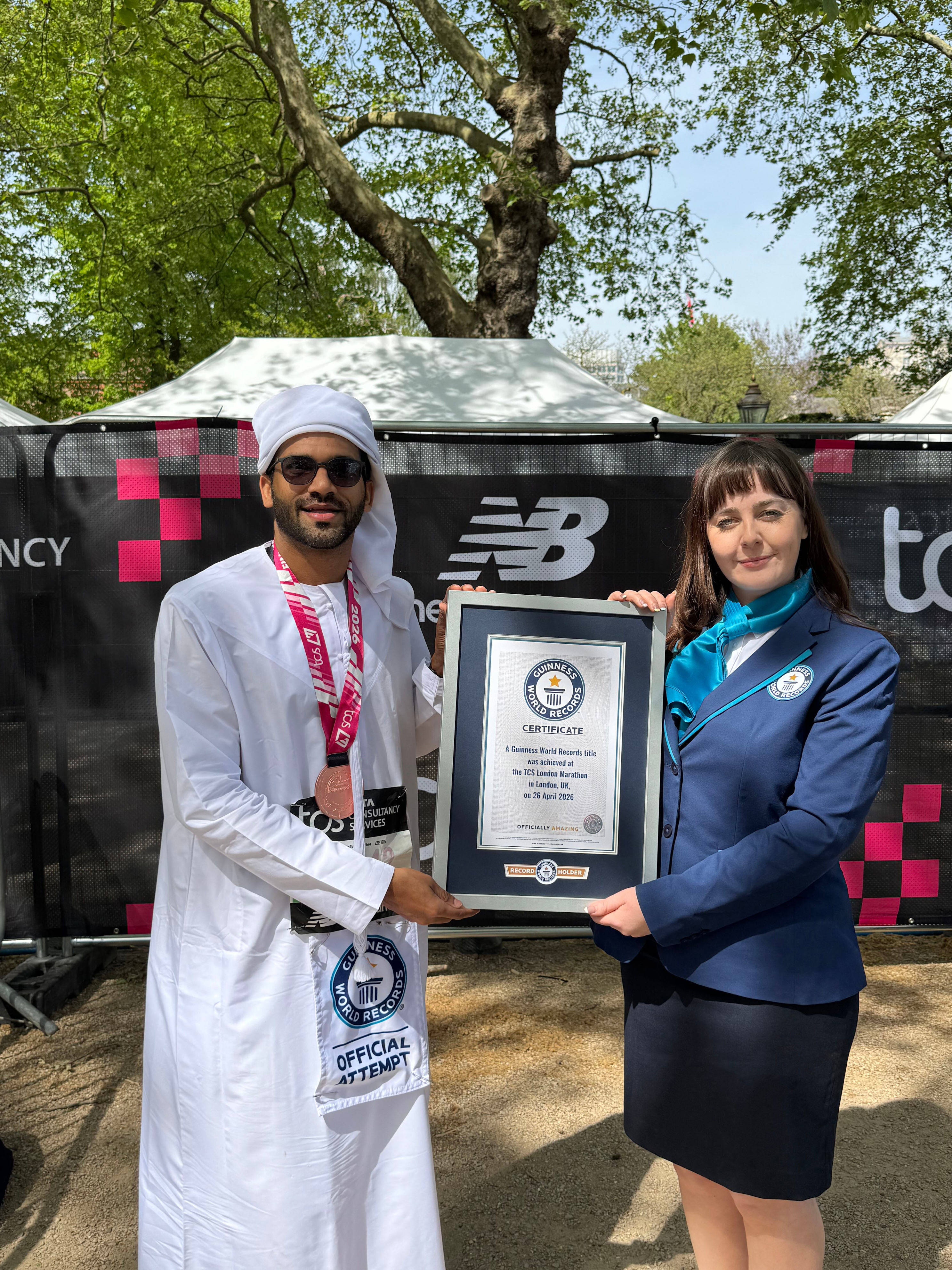 Runner sets world record for fastest marathon wearing in traditional ...