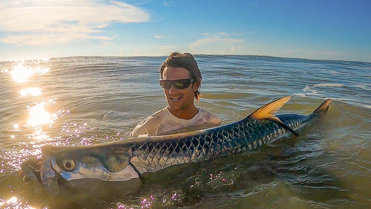 He grabbed a 100lb monster in the water - caught on camera