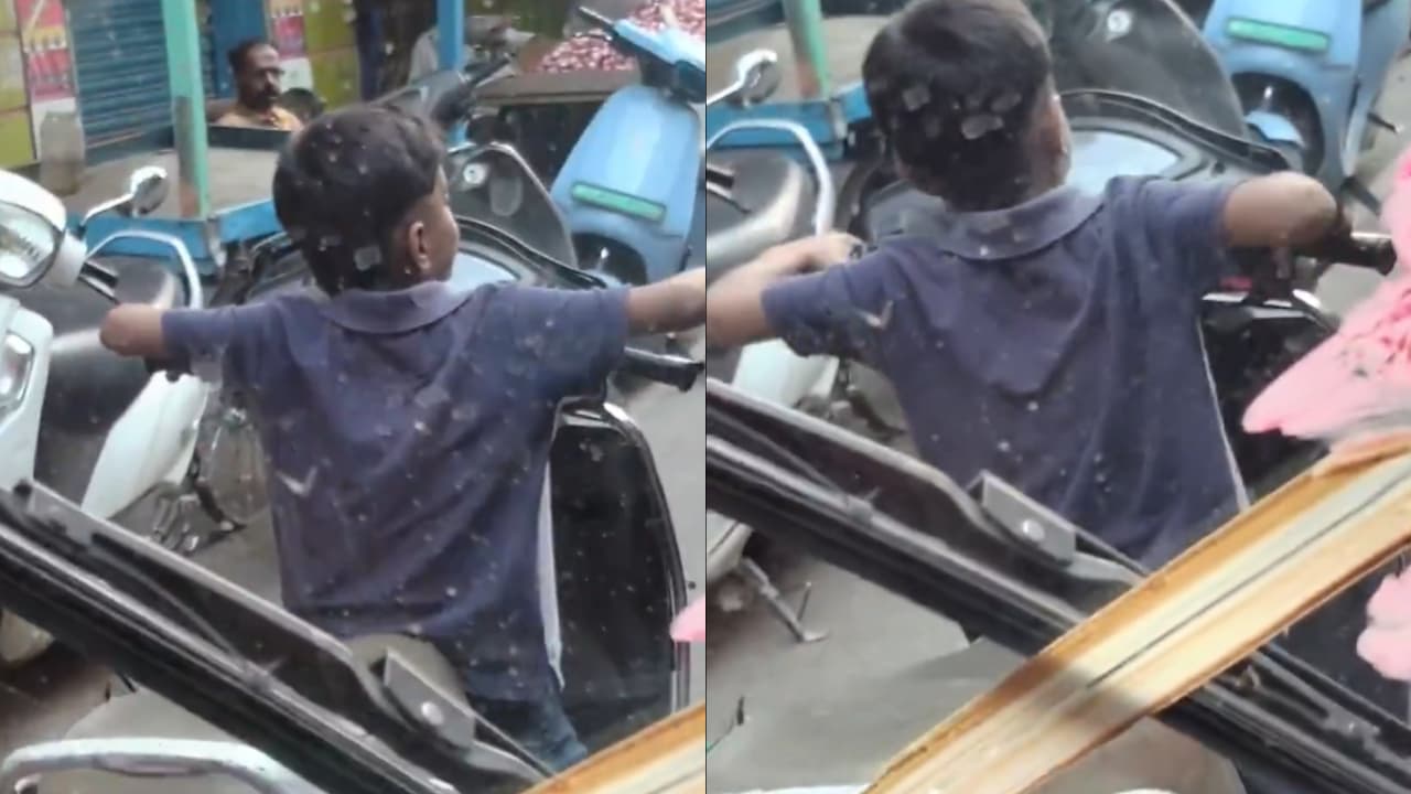 Bengaluru: Minor seen riding two-wheeler in traffic, raising road ...