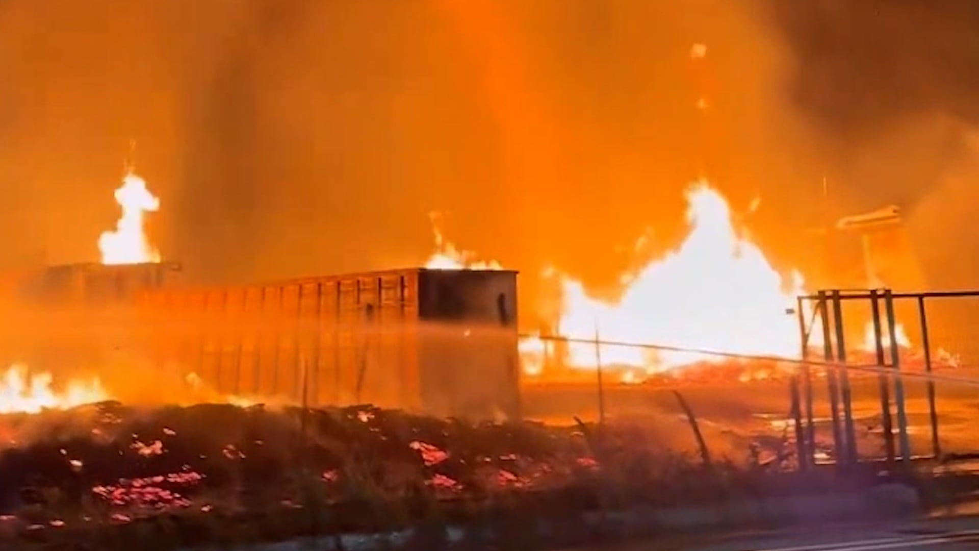 Dramatic moment fire tornado spirals into sky during huge industrial ...