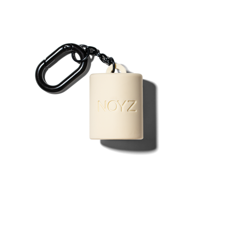 Beauty products as bag charms are trending for summer 2026