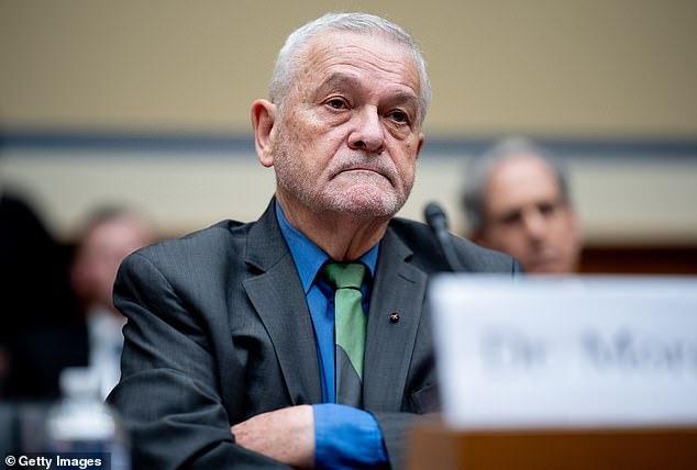 Dr Fauci's top aide's face says it all as he's booked in court on ...