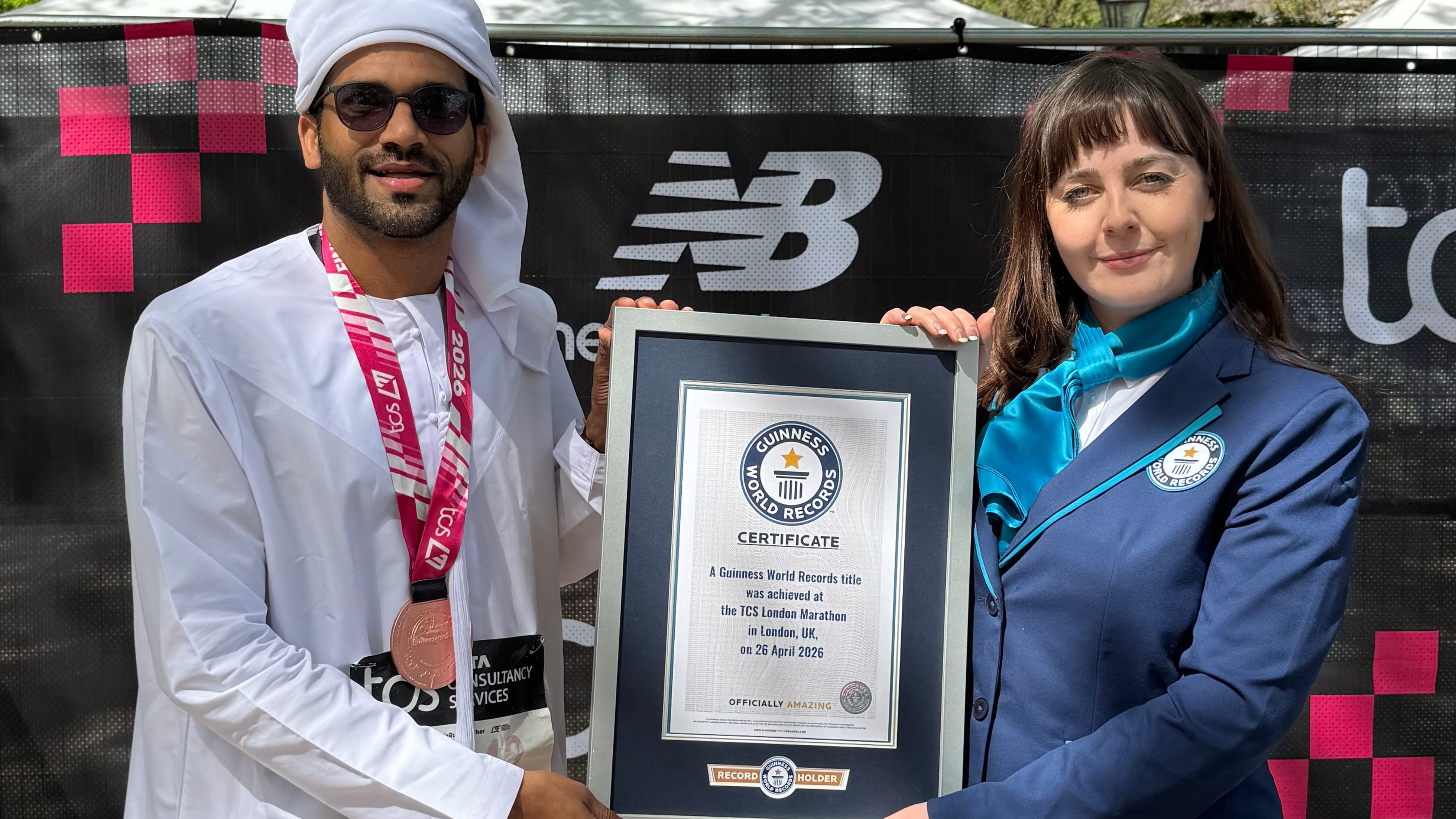 Runner sets world record for fastest marathon wearing a kandura while ...