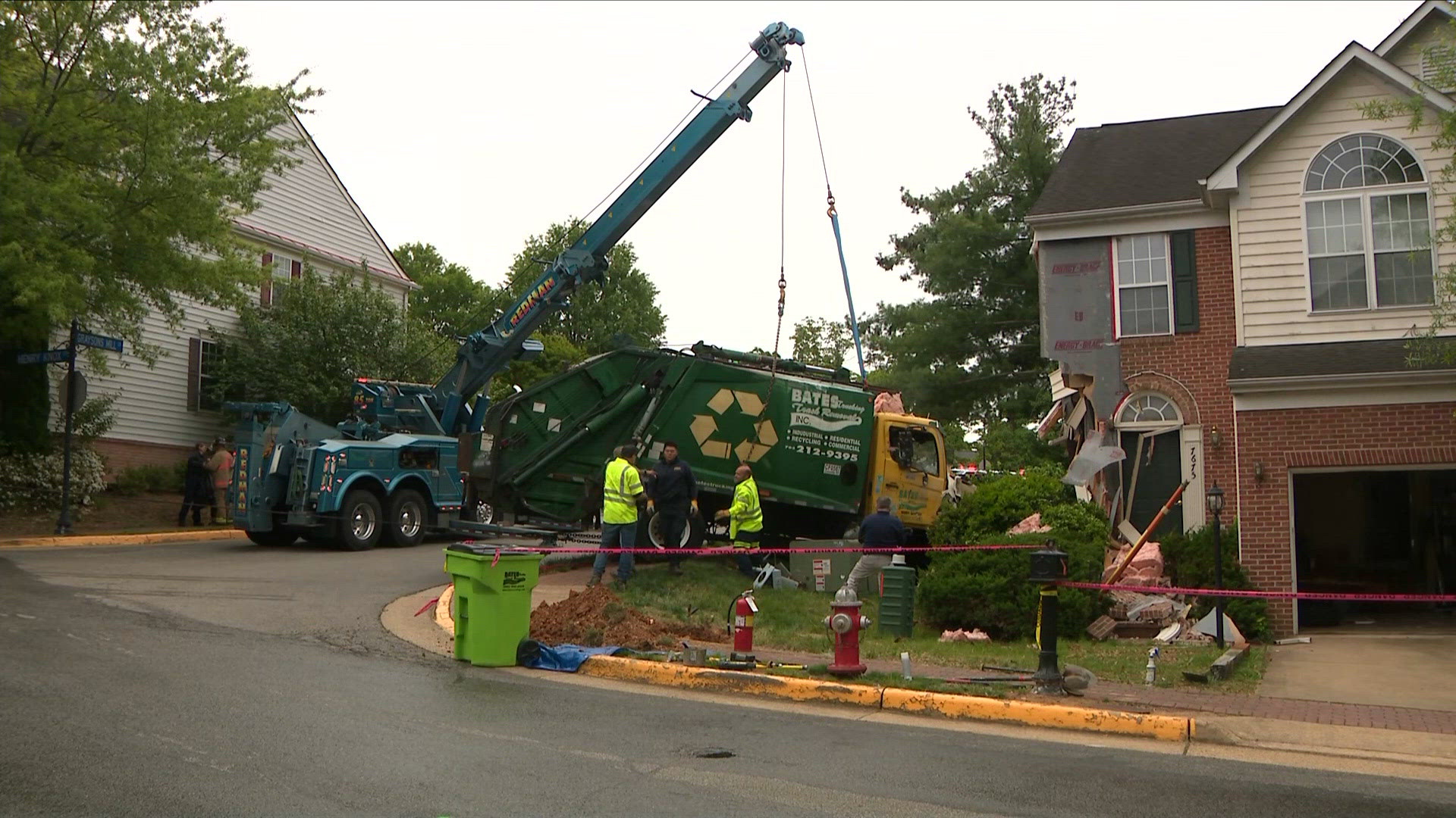 Garbage truck hits house, gets stuck in Lorton home's basement