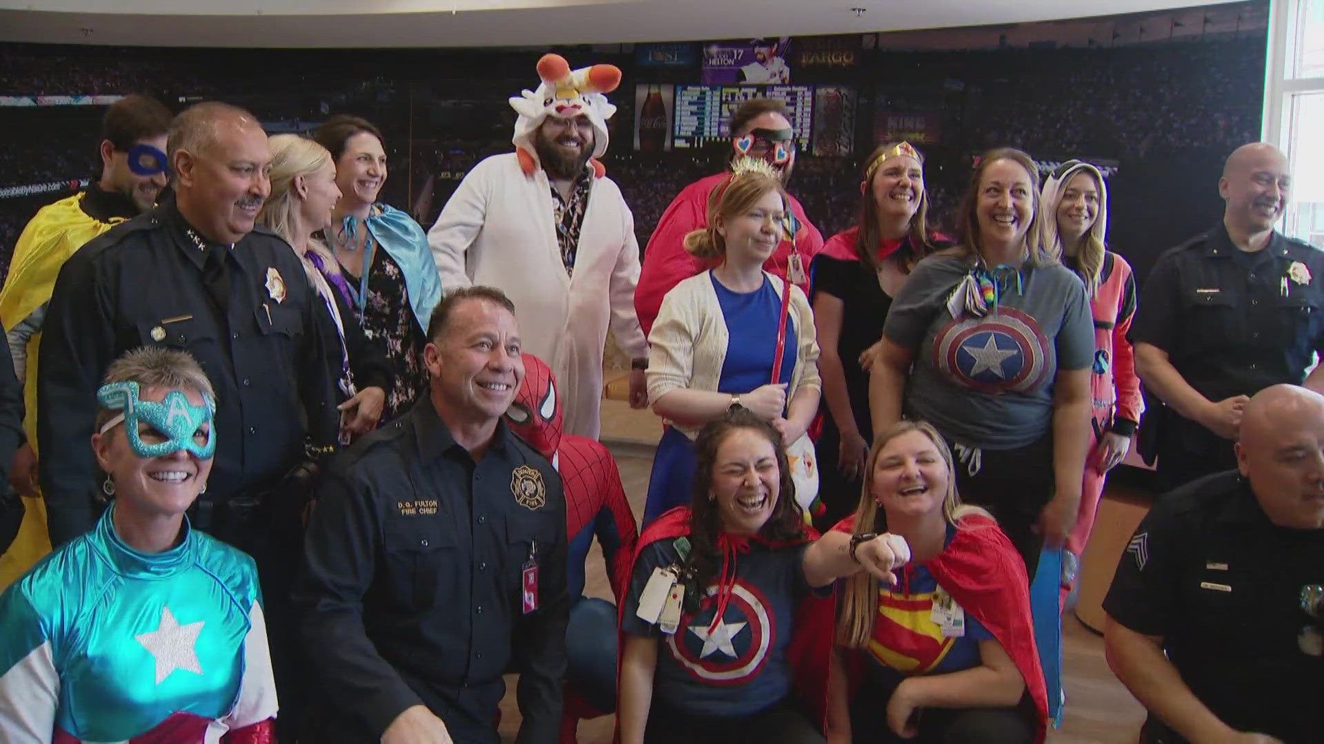 Superheroes visit pediatric patients at Denver Health