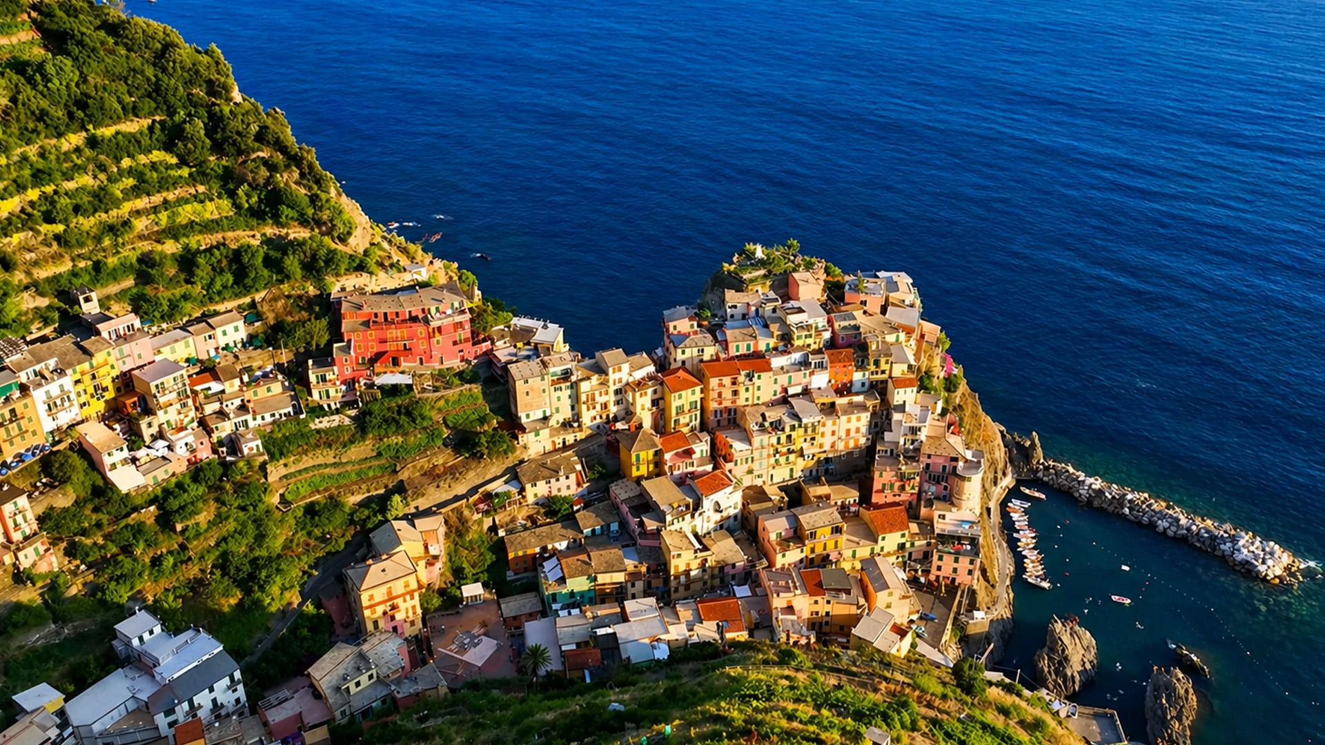 Houses stacked on a steep coastal cliff