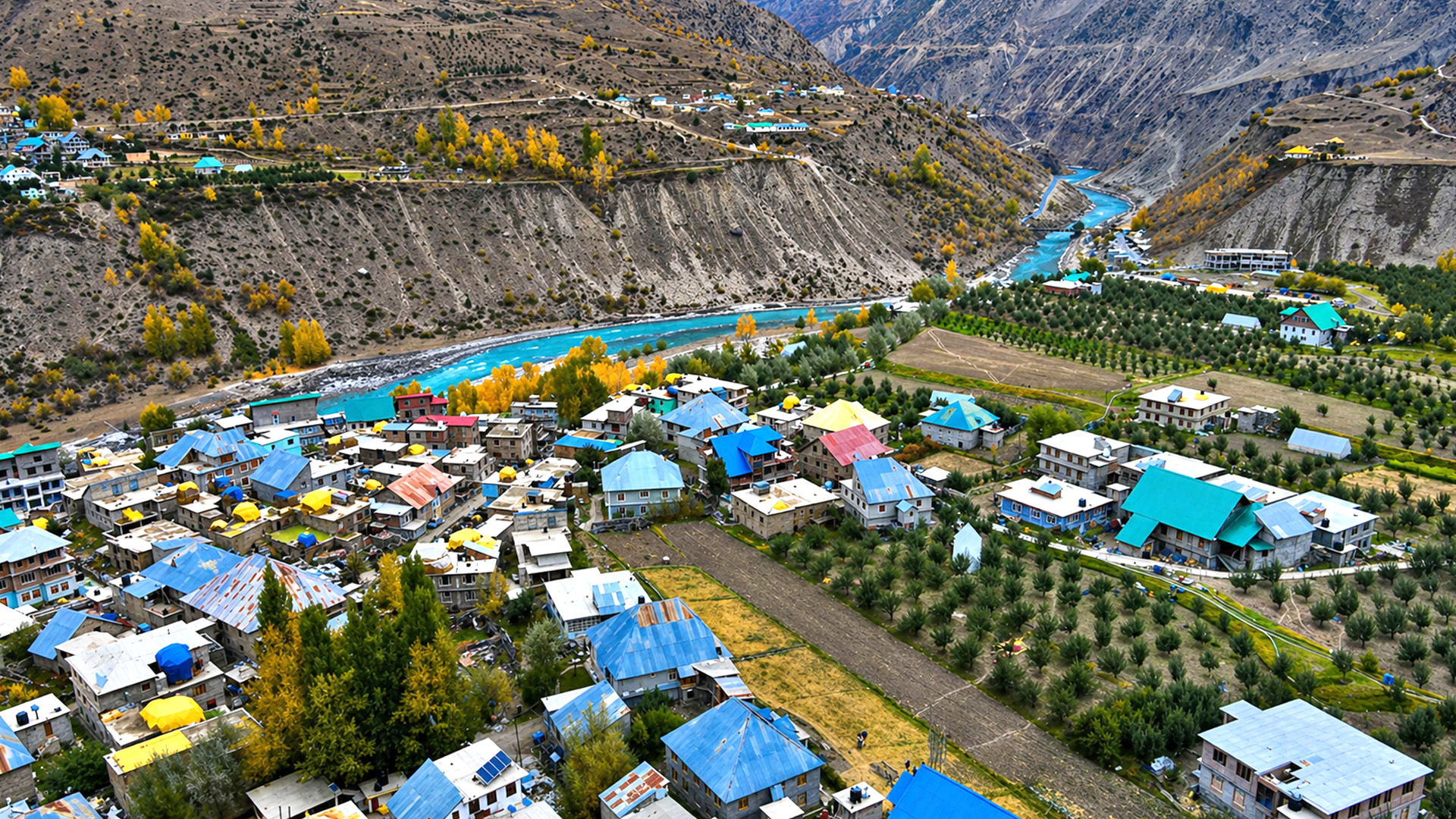 A remote village hidden in the Himalayas by a river