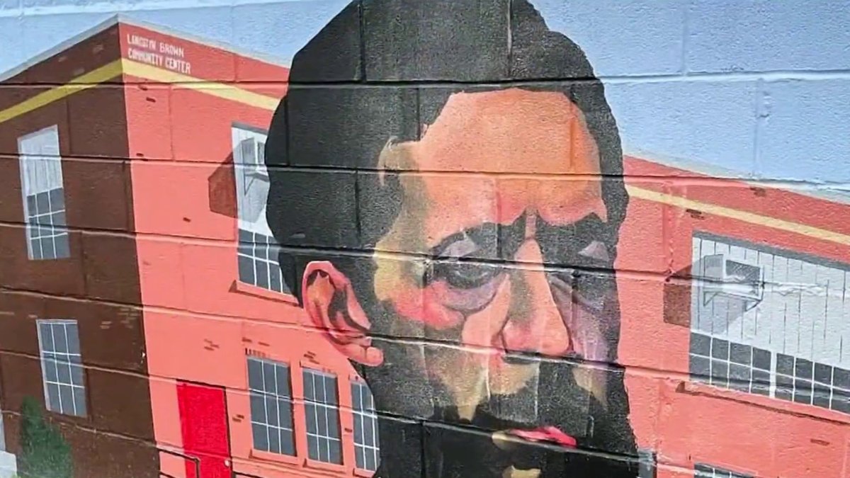 Artist repaints Black history mural telling Arlington neighborhood's ...