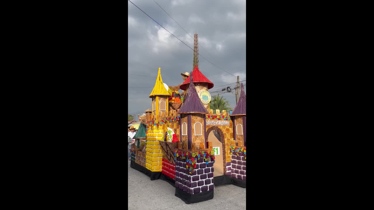 Festivalgoers celebrate dessert festival with vibrant fruit-themed parade