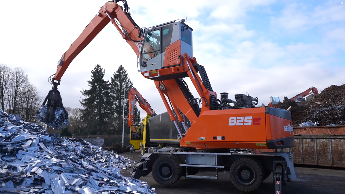 Massive scrap handler moving metal with incredible power