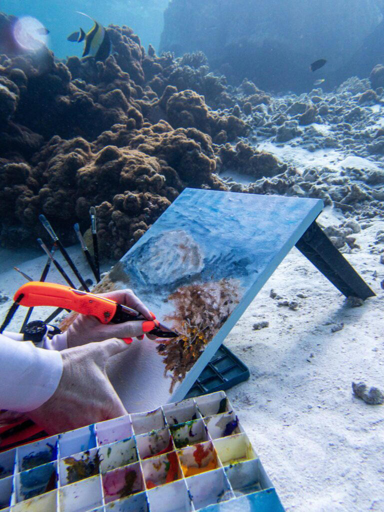 Artist in scuba gear paints underwater art that sells for up to £8.5k