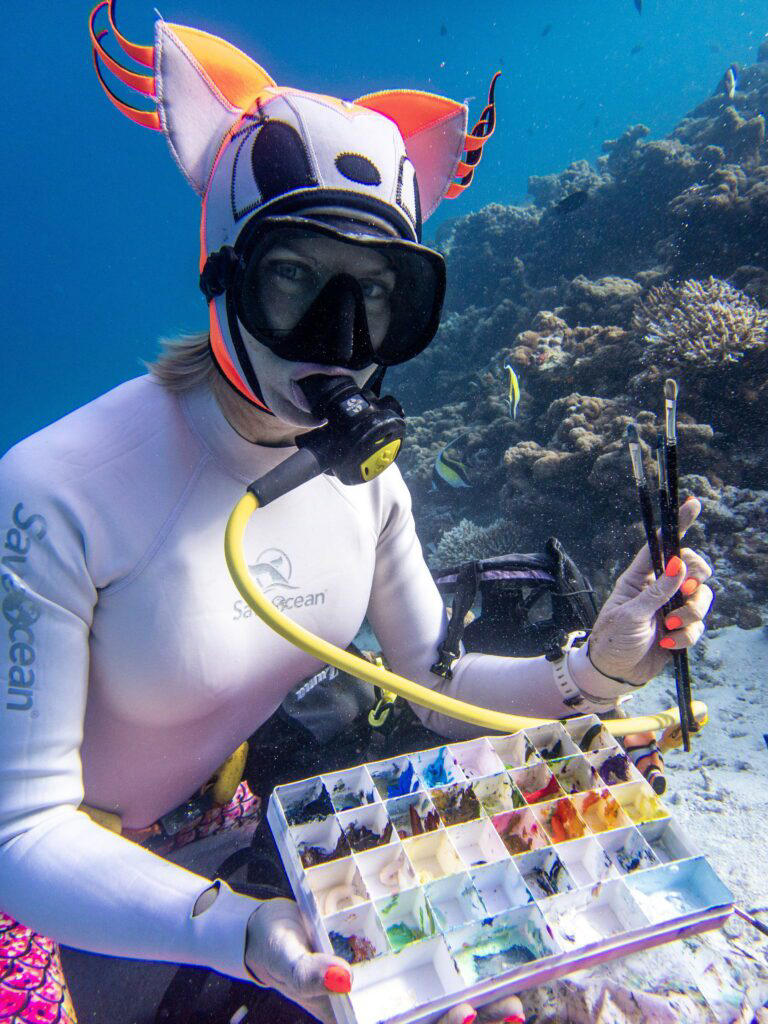 Artist in scuba gear paints underwater art that sells for up to £8.5k