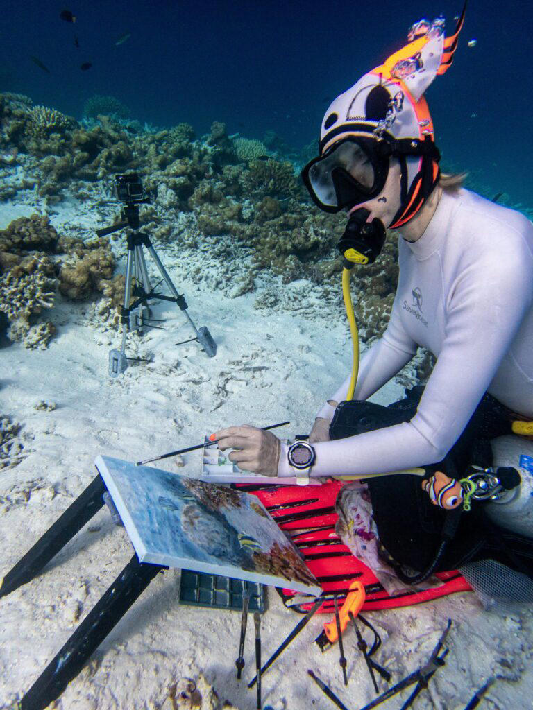 Artist in scuba gear paints underwater art that sells for up to £8.5k