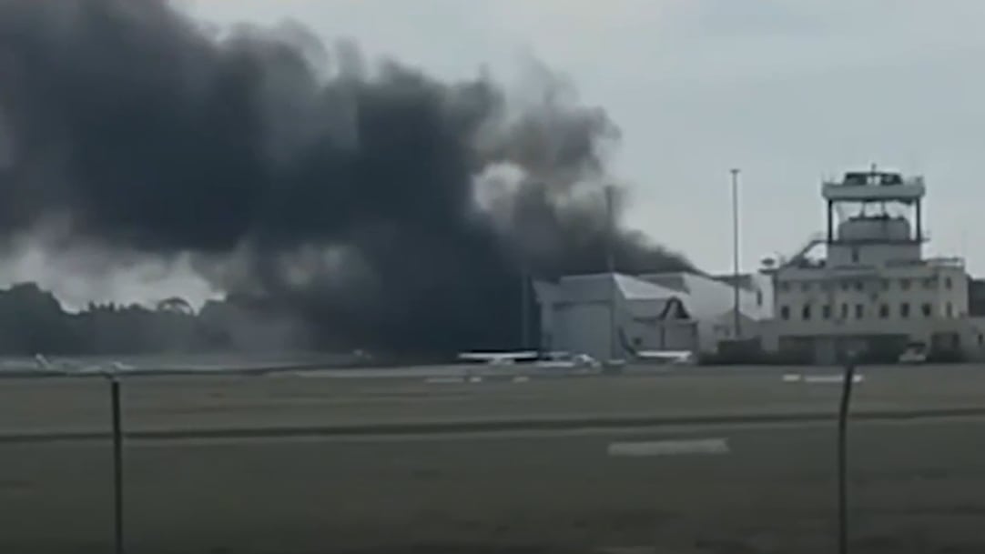 At least two dead after plane crashes into building