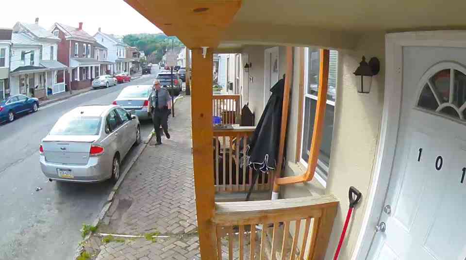 Police officer tapes over private security camera