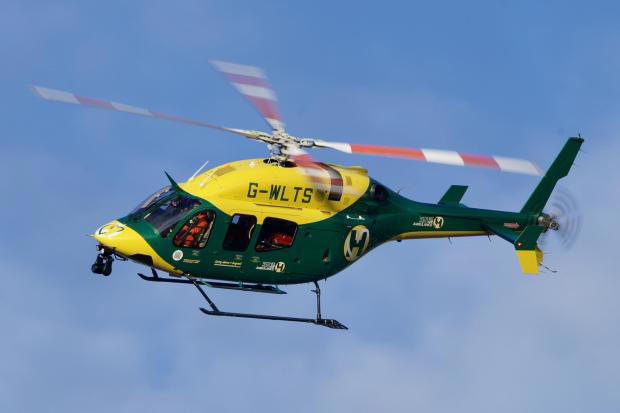Air ambulance lands following crash between motorbike and car
