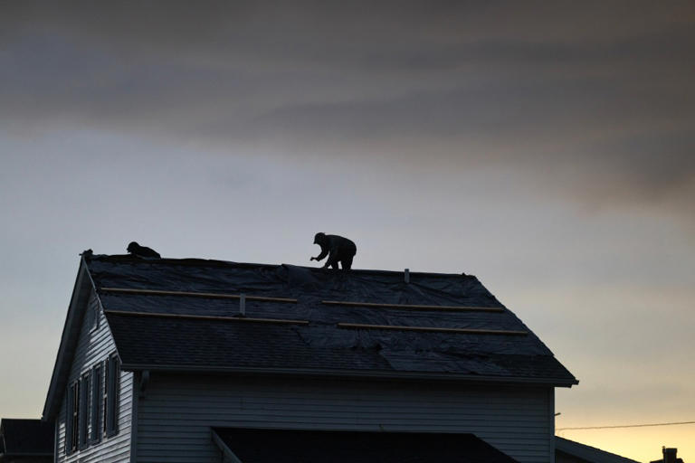 Dozens of tornadoes rip down power lines, roofs in severe storm surge