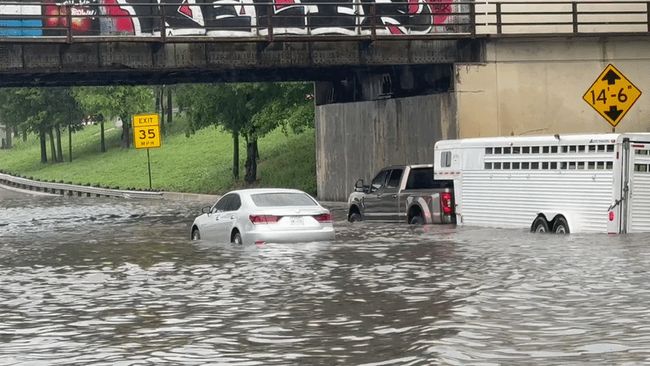 Motorists struggle through floodwaters in Houston