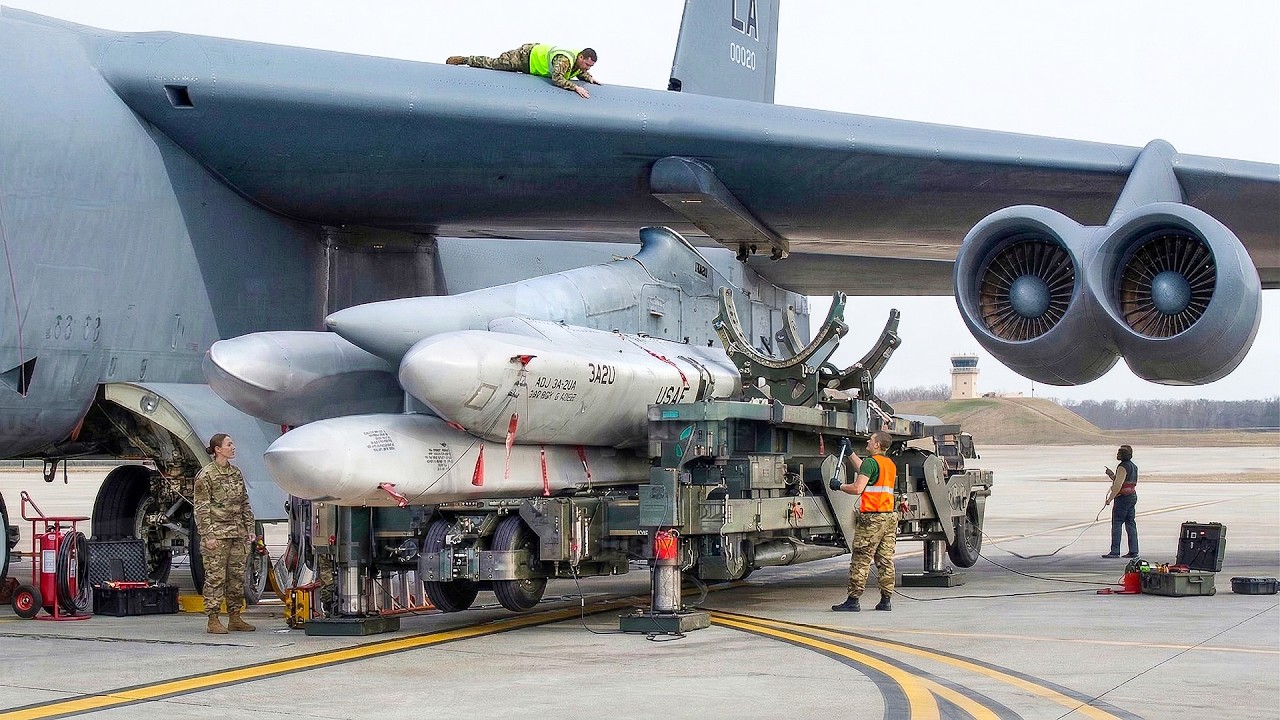 US Air Force loading gigantic rotary missile launcher inside B-52 bomber