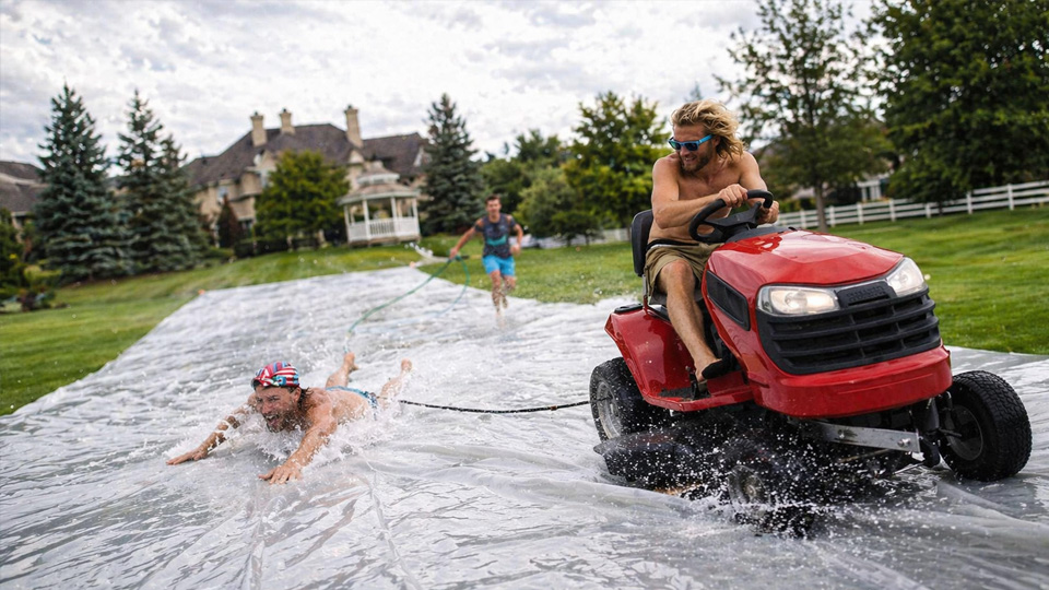 Lawn mower ride turns slip and slide into action