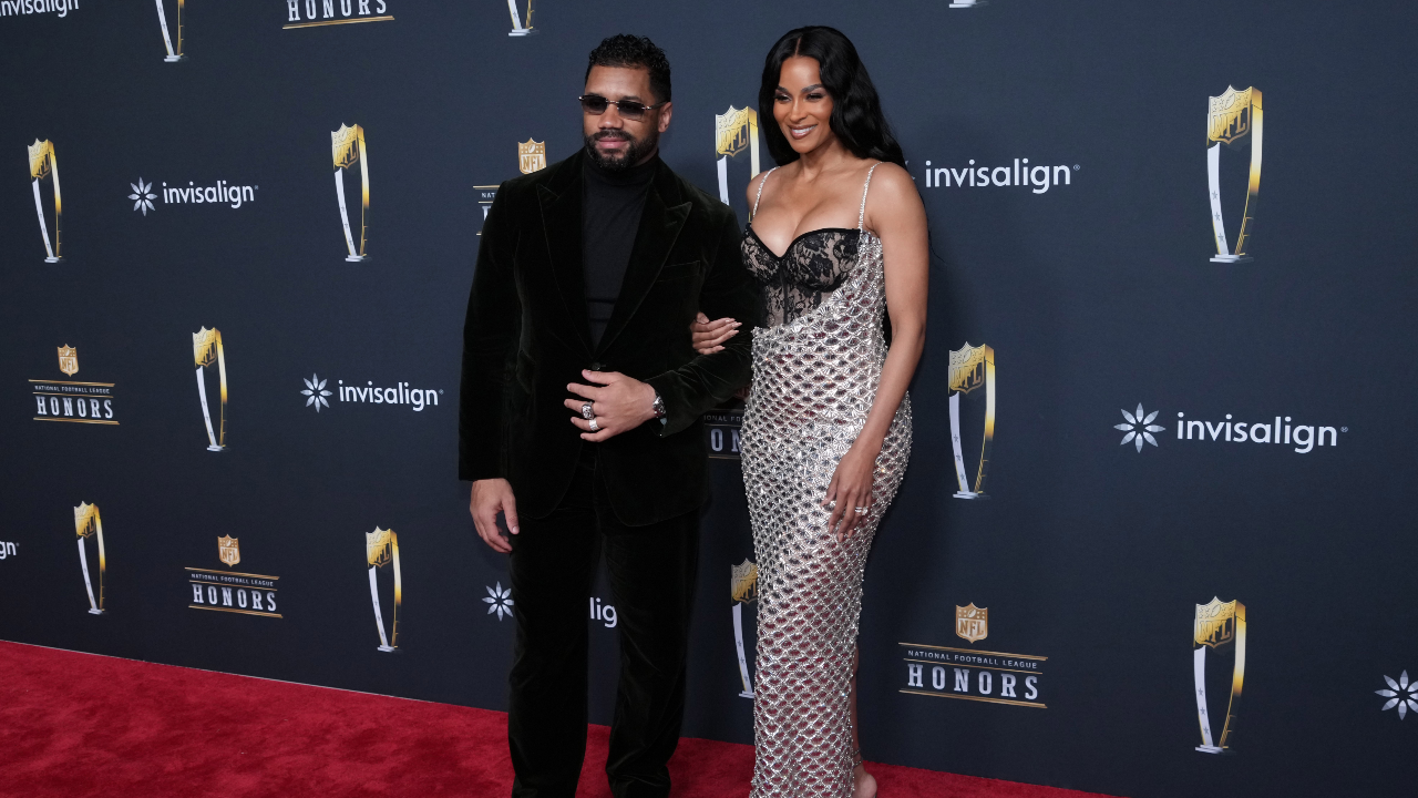 'Not blinking' Wilson hits beach with Ciara after 4 teams dumped him in ...