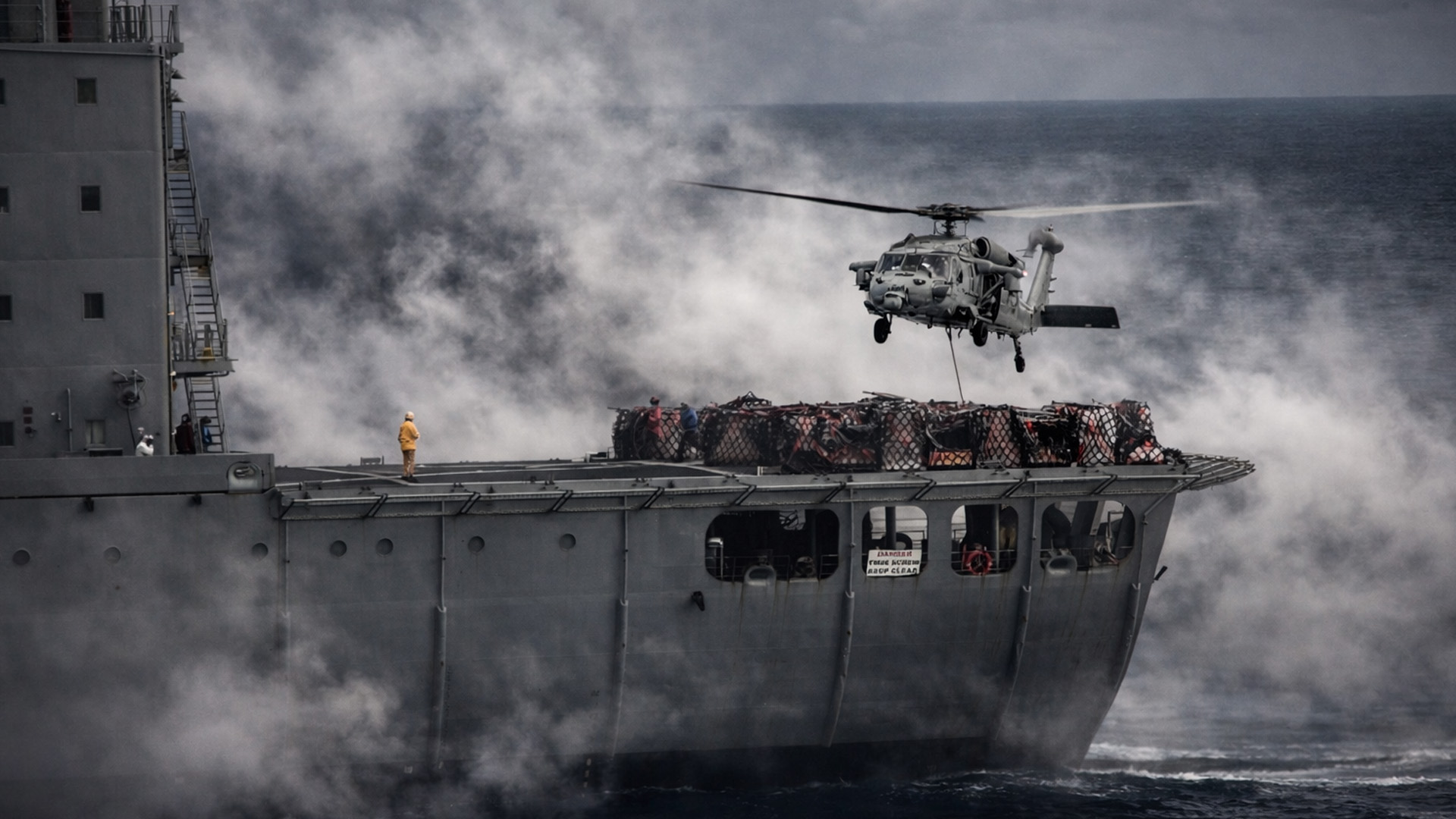 US Navy ships transfer supplies while underway