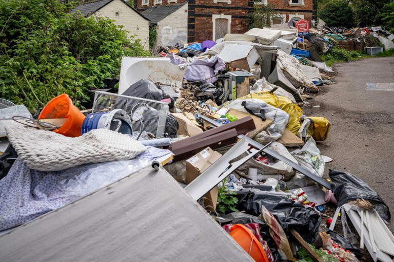 Fly-tippers dump five-foot wall of rubbish at historic railway station