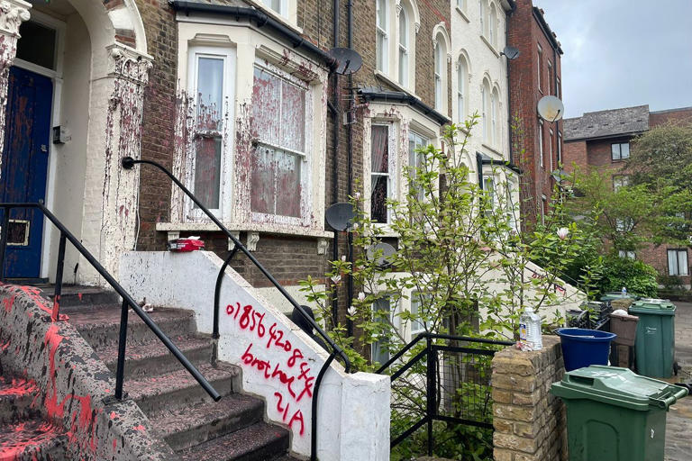 Locals left 'traumatized' after homes defaced with mysterious red and ...