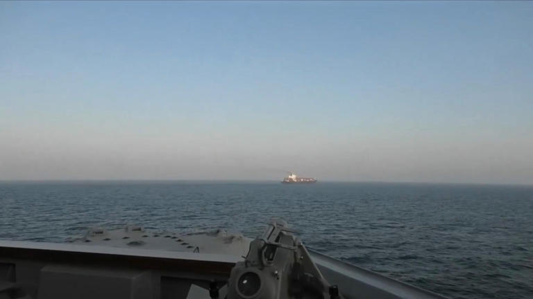 US Navy destroyer blows a hole through Iranian cargo ship that tried to ...