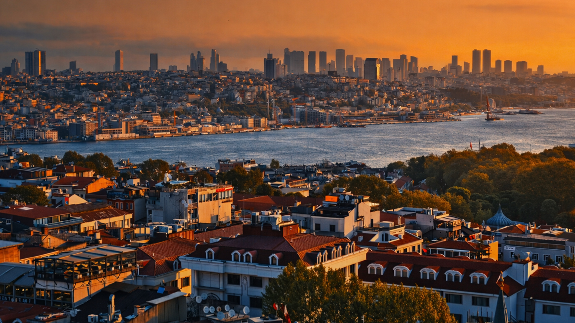 City skyline at sunset with river and urban architecture