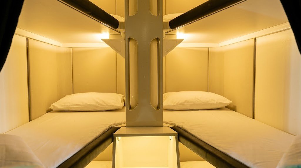 This airline’s new sleep pods let economy passengers book lie flat beds ...