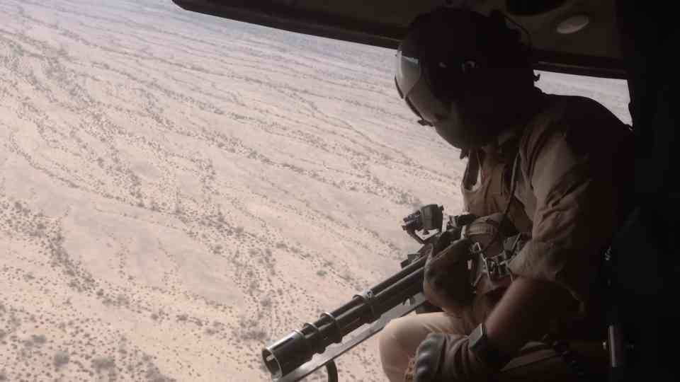 See a US Marine Corps attack helicopter crew shoot down a drone