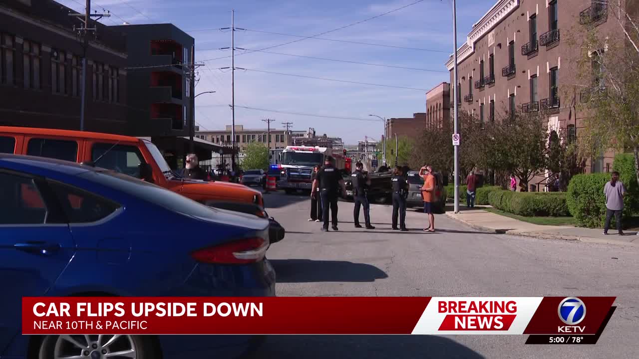 Car flips upside down after crash in Omaha