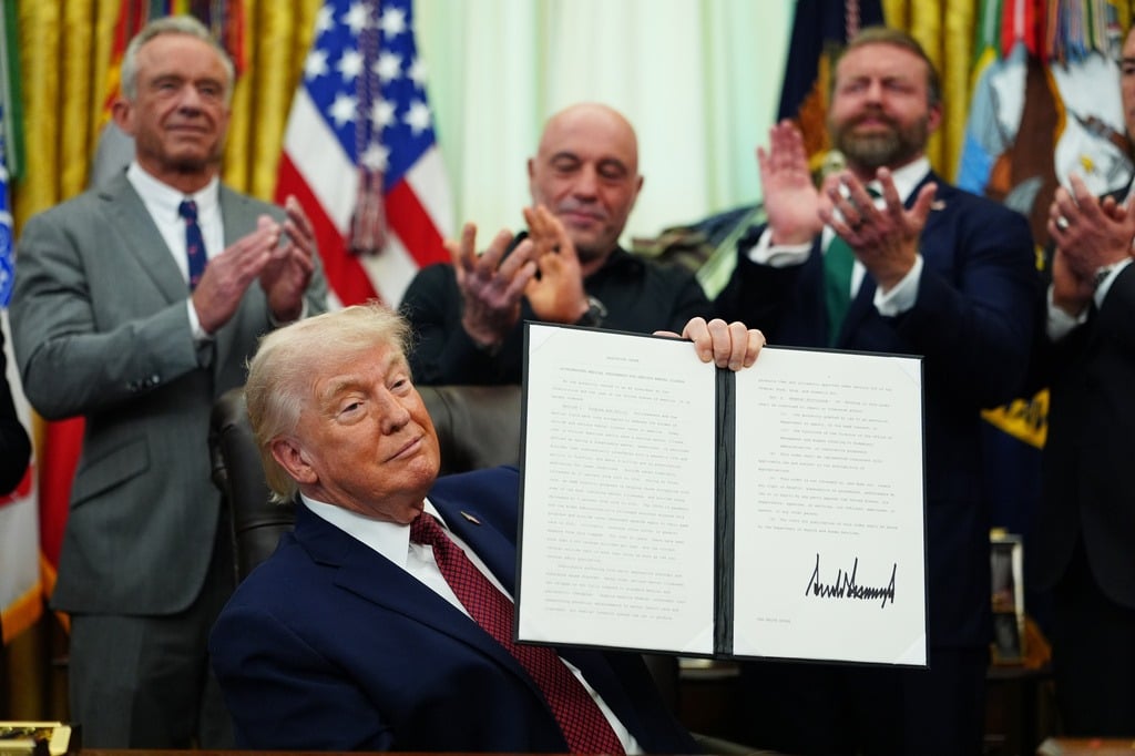 Joe Rogan joins Trump at Oval Office as he signs order to fast track ...