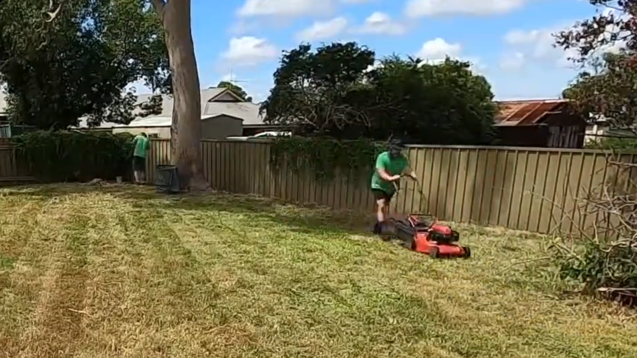 Voluntary yard cleanup tackles one of the biggest push mowing jobs ever