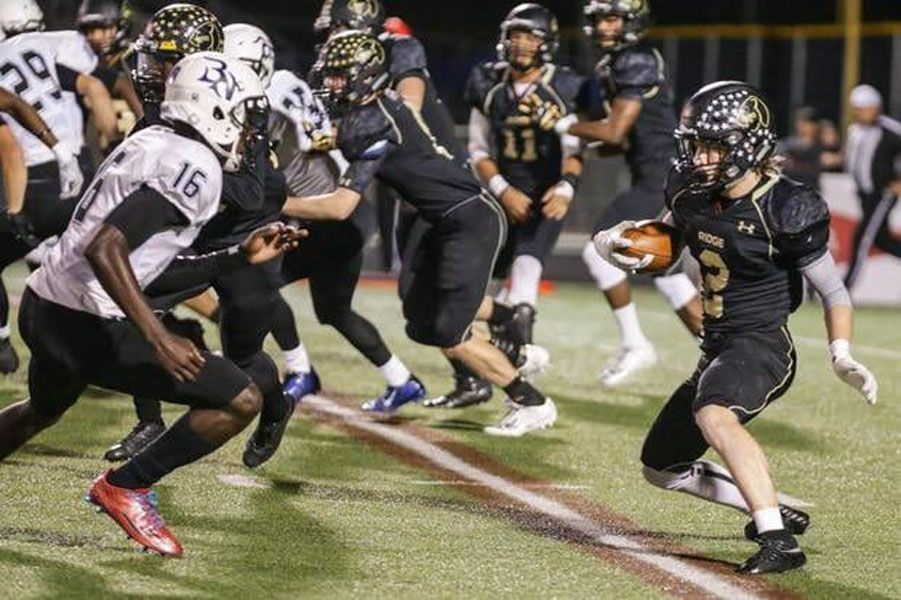 Quarterback hands crown to sideline hero