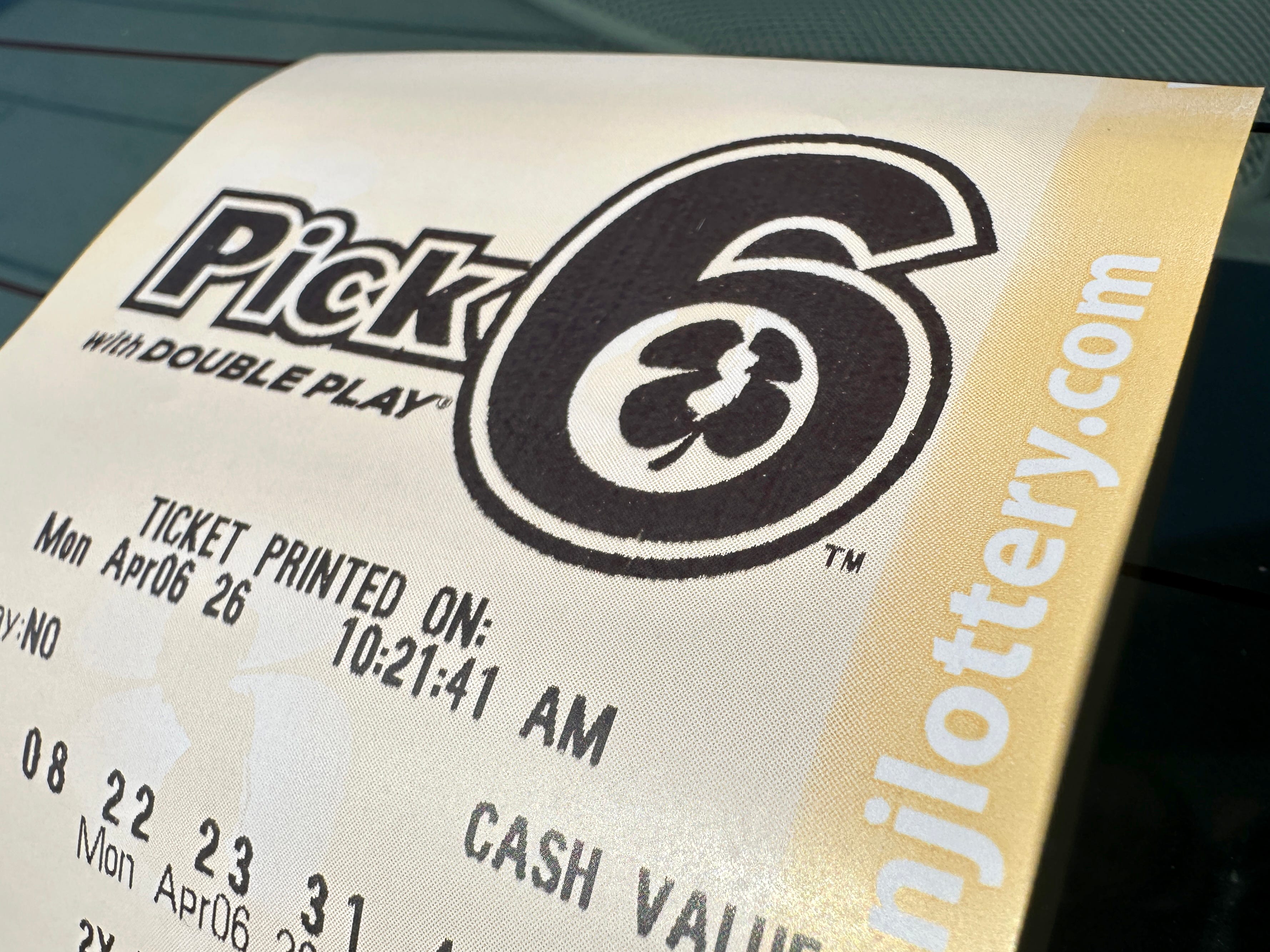 NJ lottery player finds crumpled $5.9M ticket in closet just in time
