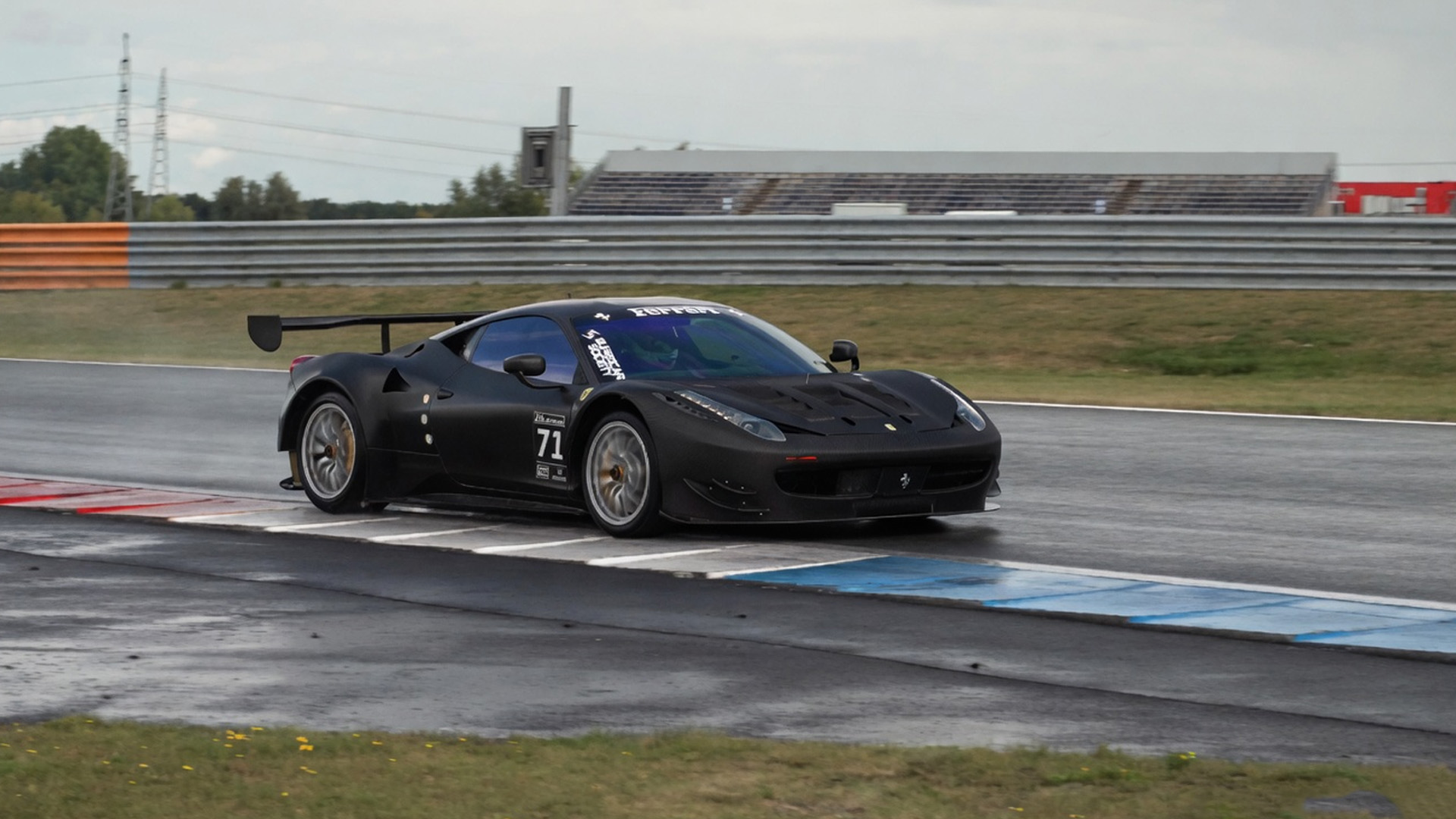 Street legal Ferrari 458 almost losing grip on wet track