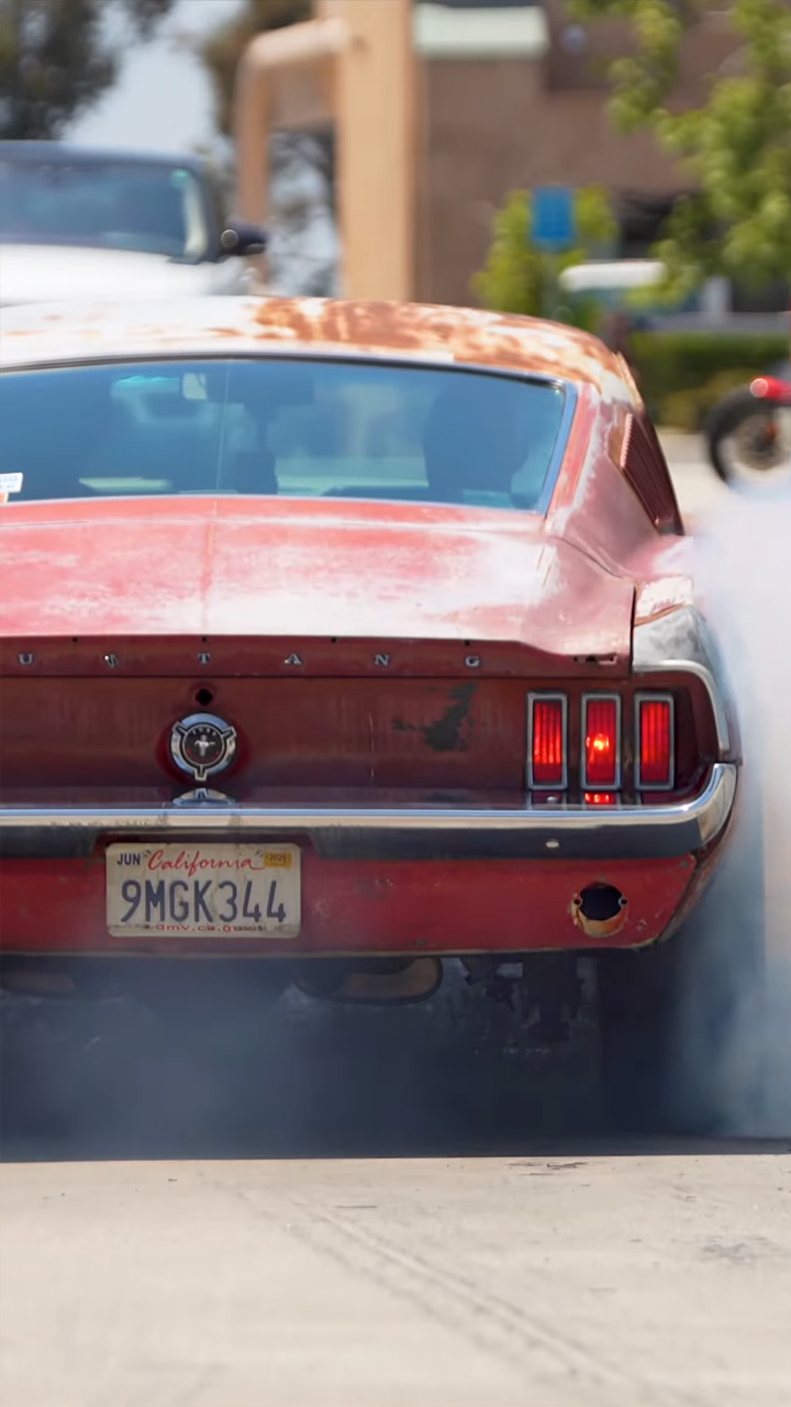 Classic Mustang spins hard and fills air with smoke
