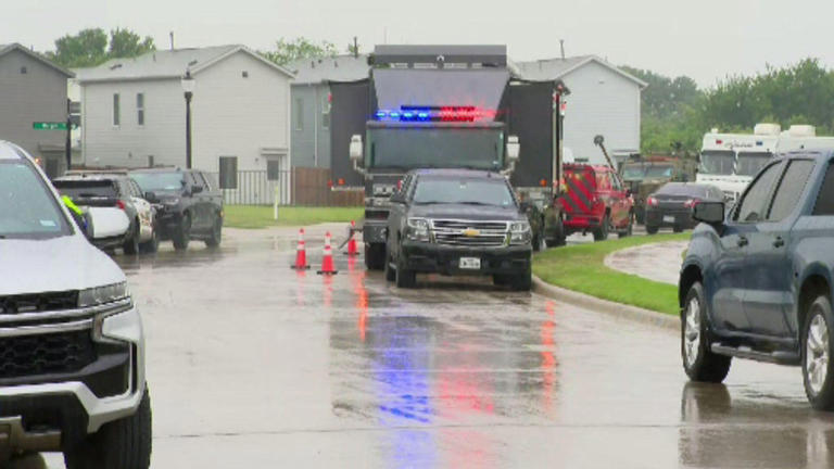 Woman rescued, suspect in custody after day-long standoff at North ...