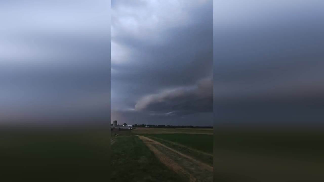 Turbulent shelf clouds sweep over Kentucky farmland during severe storm ...