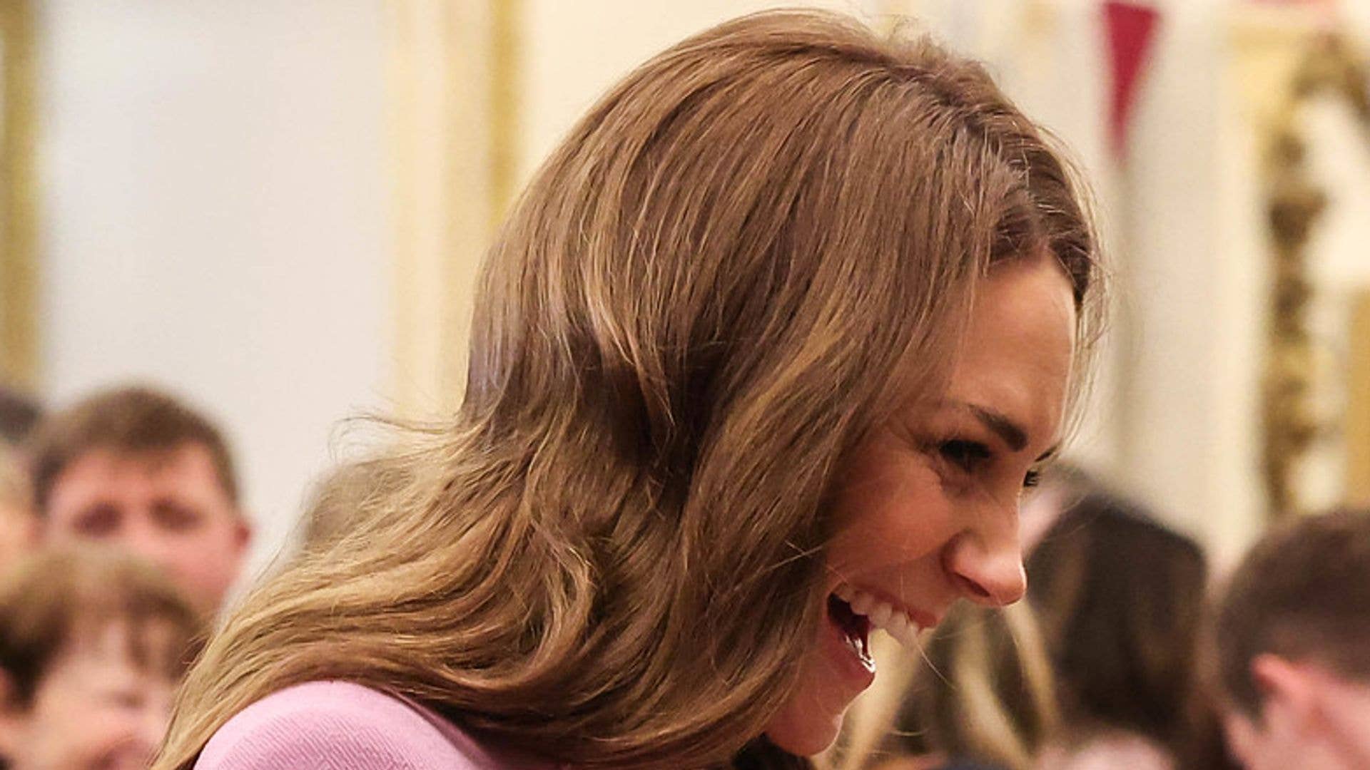 Princess Kate can't contain her giggles as she grabs Prince William mid ...