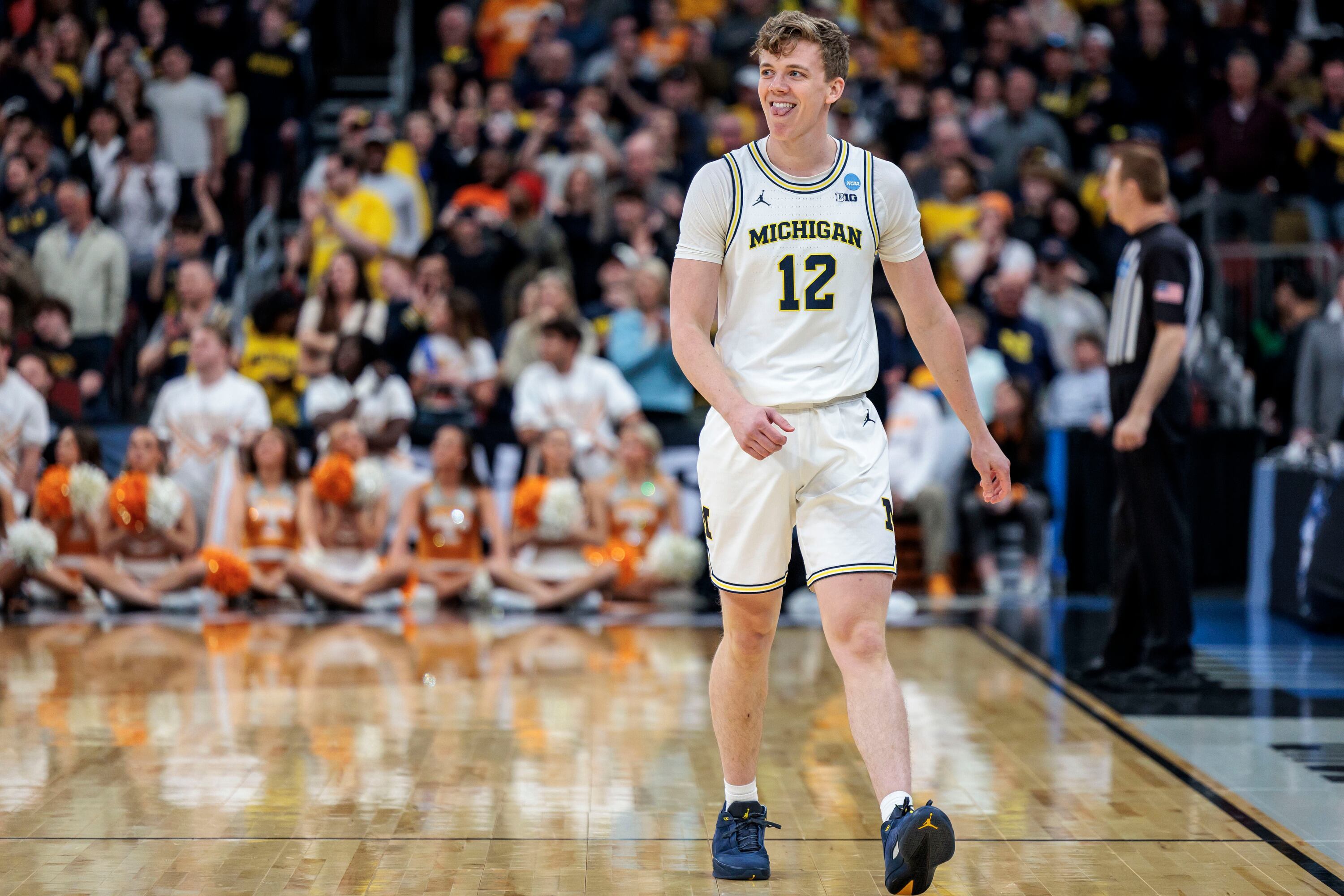 Michigan coach’s son will work for his dad’s former boss