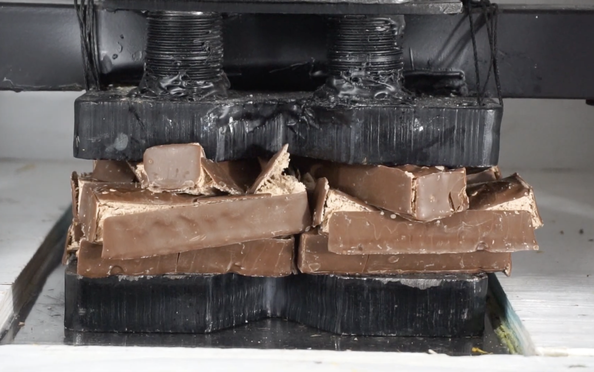 Crushing 20 candy bars with a hydraulic press