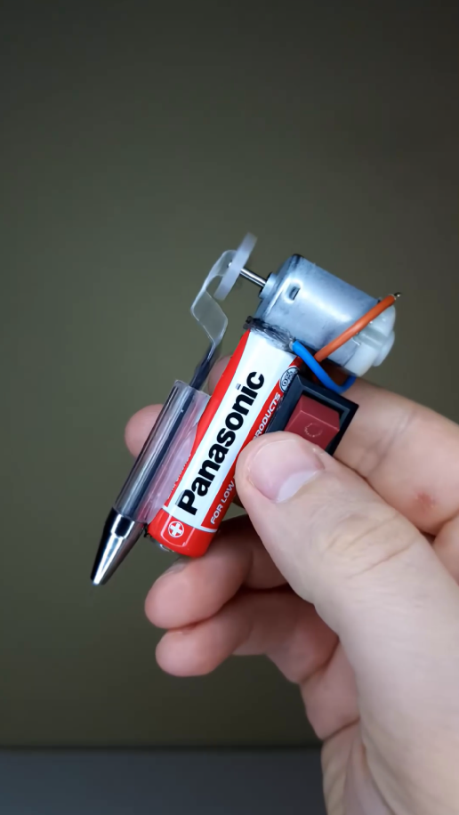 DIY mini tattoo machine made from battery and motor