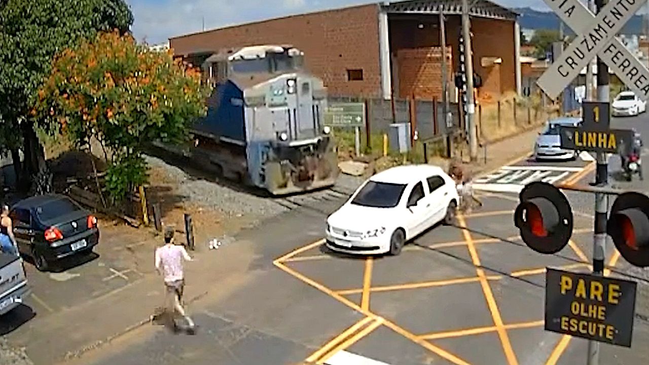 Train plows into car stuck on level crossing in Brazil