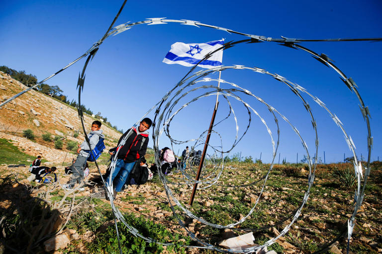 Israeli settlers block Palestinian children from school in the West Bank