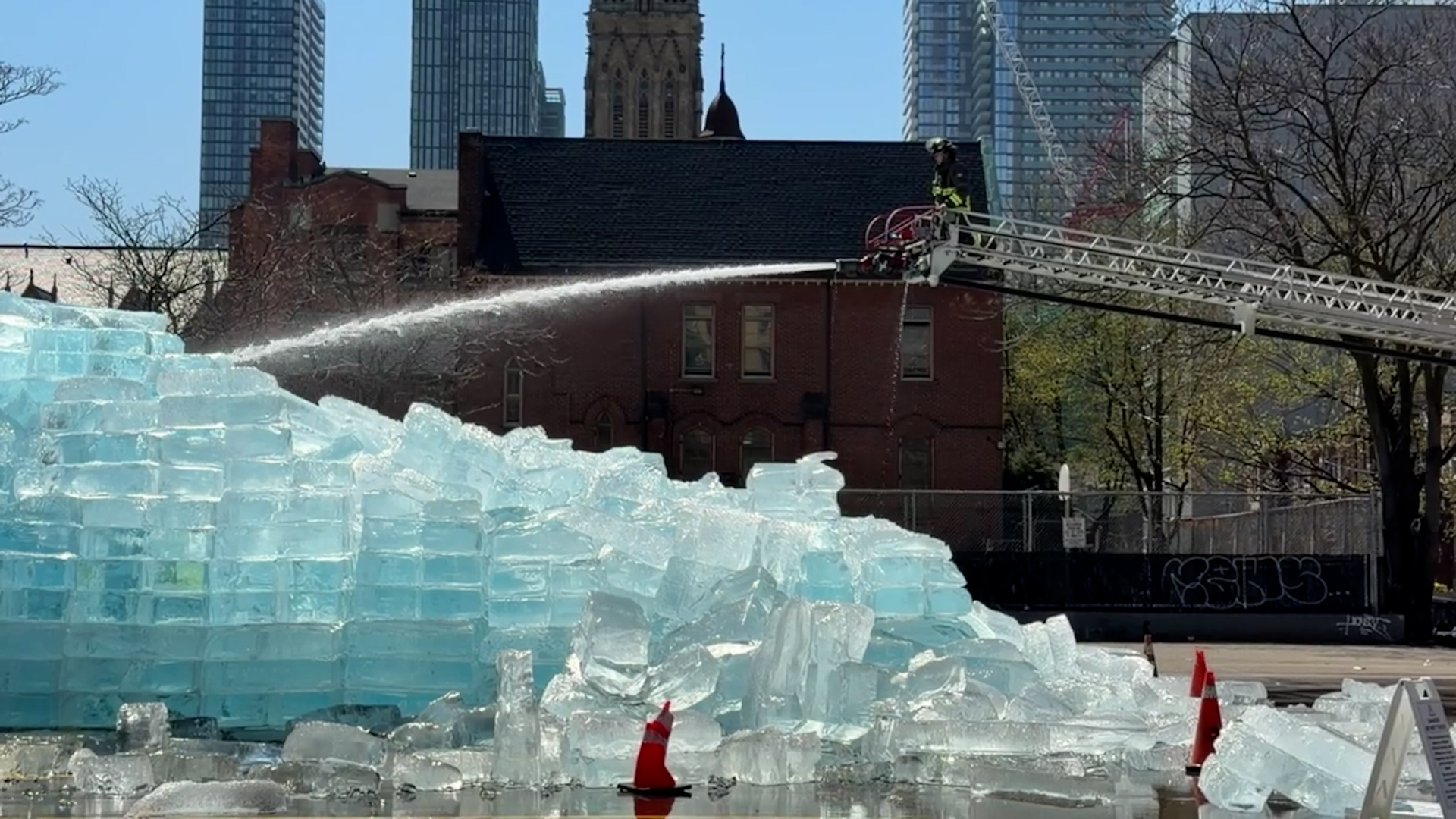 Drake's ice structure being melted by firefighters