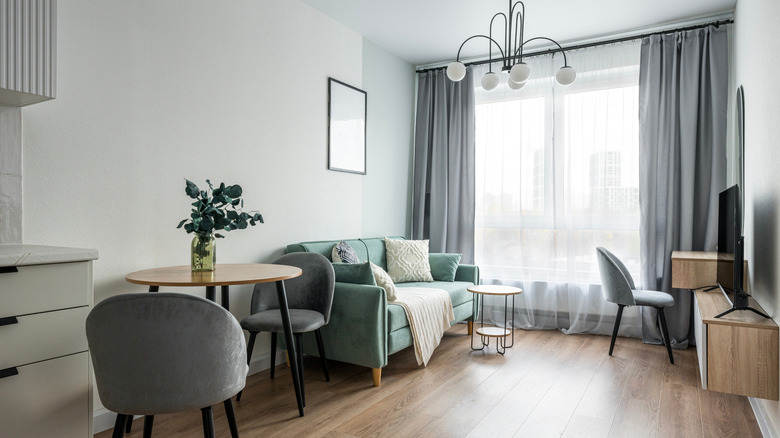 The designer trick that makes a narrow living room feel way bigger