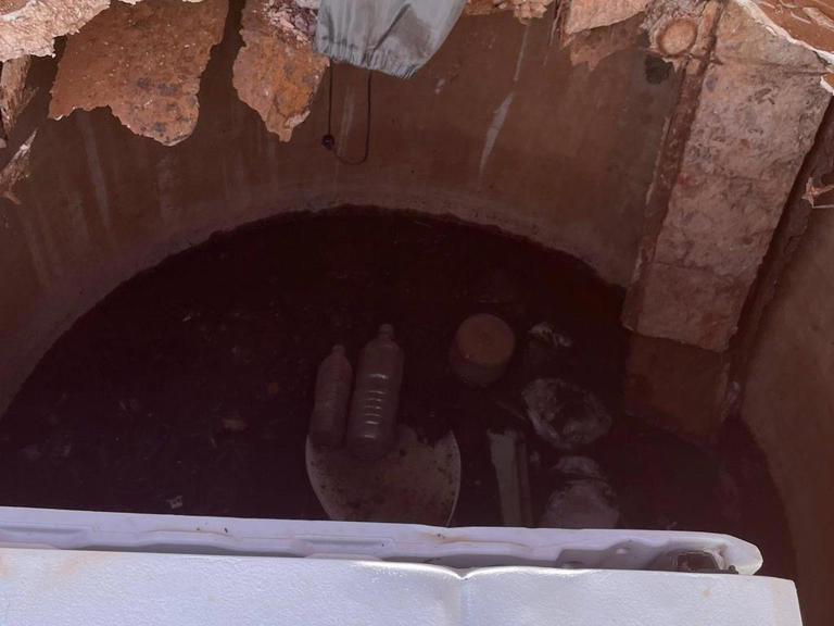 Tourist falls through long drop, stuck in poo